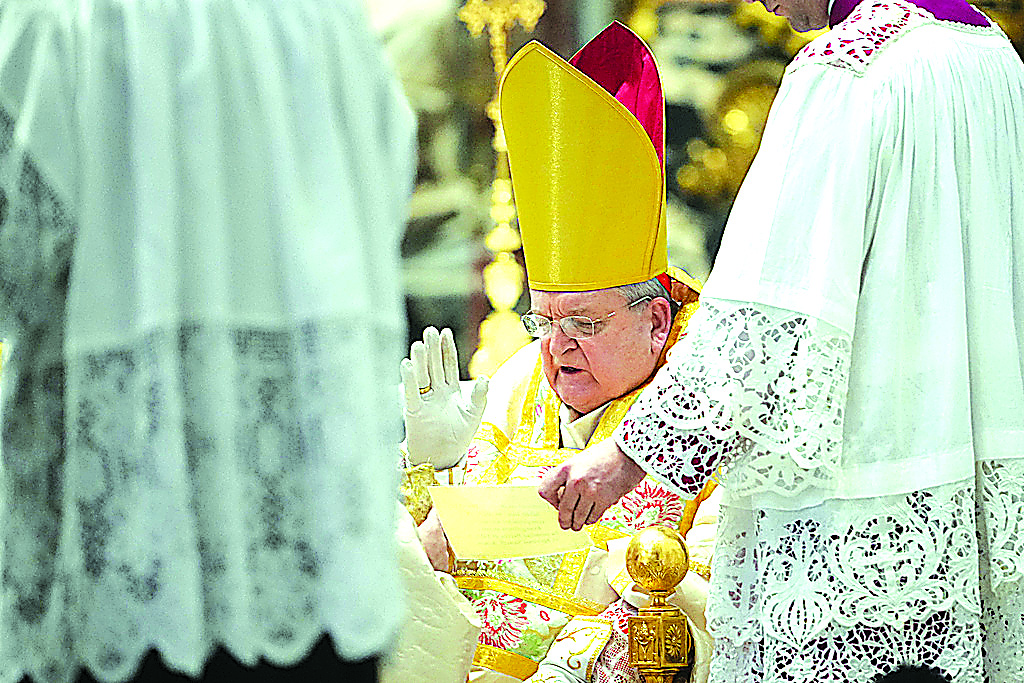 An American cardinal celebrates old Latin Mass in St. Peter’s in a sign ...